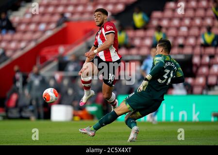 Manchester City goalkeeper Ederson clears a flare of the pitch after ...
