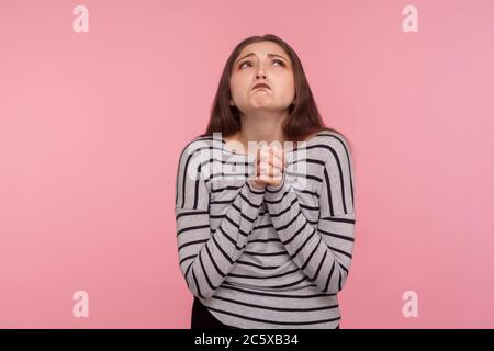 Please, I'm begging! Portrait of desperate ginger girl in shirt keeping ...