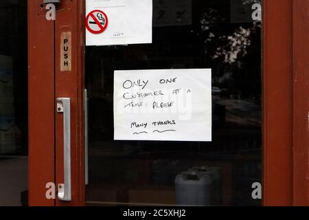 Social distancing sign for shop customer queue Stock Photo - Alamy