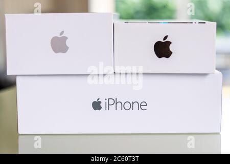 Close up of a pile of a collection of Apple iPhone boxes generations ...