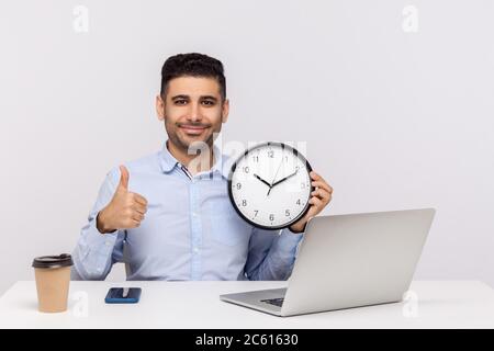 Young employee in time management concept Stock Photo - Alamy