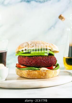 vegan burger without meat with avocado, tomatoes and spinach on the ...