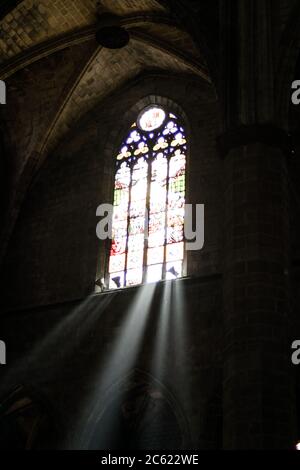 Light ray entering a Christian church lighting up the interior of the ...