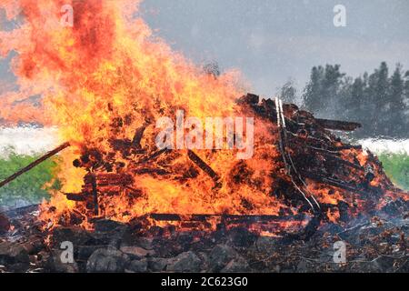 Midsummer bonfire. Traditional Finnish celebration Juhannus Stock Photo ...