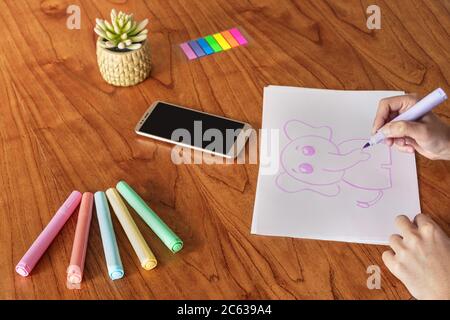 Hands of a woman drawing with colored markers at home Stock Photo - Alamy