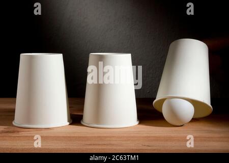 Disposable paper cups and ping pong ball Stock Photo - Alamy
