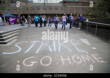 “Strike go home” is written in chalk on the ground outside the main ...
