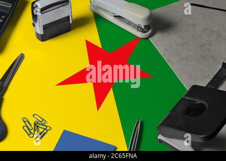 French Guiana flag concept with plastic beer pong cups and laptop on ...