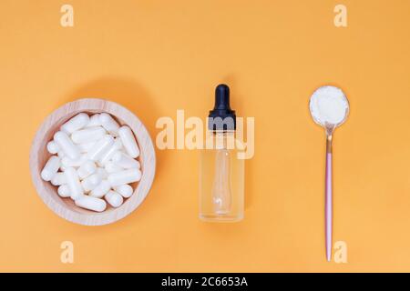 Collagen products on yellow background Stock Photo - Alamy