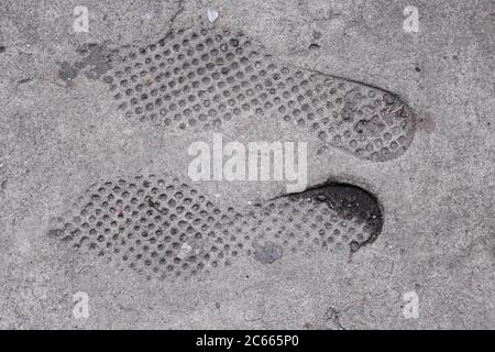 Footprints in concrete Stock Photo - Alamy