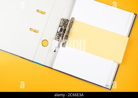 above view of open ring binder, file folder on orange background Stock ...