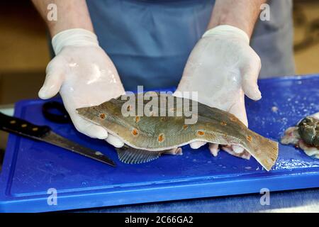Filleting a plaice step-by-step Stock Photo - Alamy