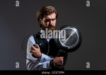 businessman with skillet. bearded man in suit hold pan. man cooking in ...