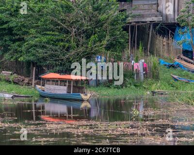 Pebas, Peru - December 04 , 2018: View of village on the bank of the ...