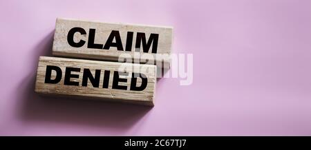 Wooden Blocks with the text: Claim Denied. Insurance Business concept ...