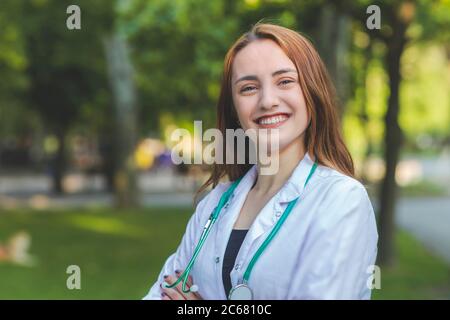 Beautiful Turkish woman doctor with warm and confident smiling in a ...