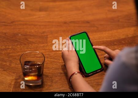 Finger tapping on blank mobile phone screen, smartphone display mockup ...