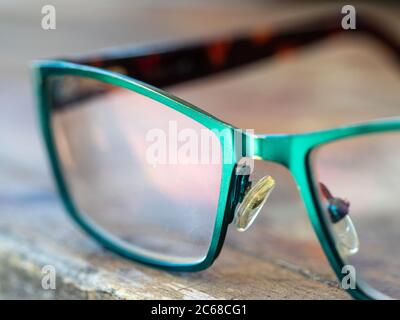 Eye sight, vision aid, Green rim reading glasses or spectacles, placed ...
