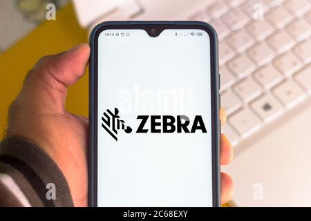 In this photo illustration a Zebra Technologies logo is displayed on a ...