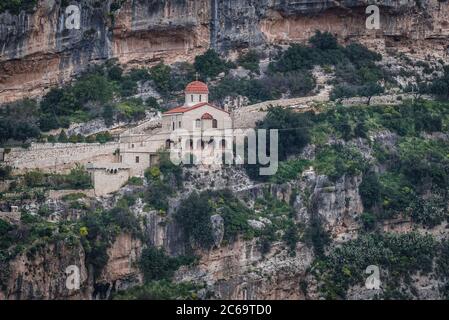 Our Lady of Hamatoura located in village of Kousba, in the rocky hollow ...
