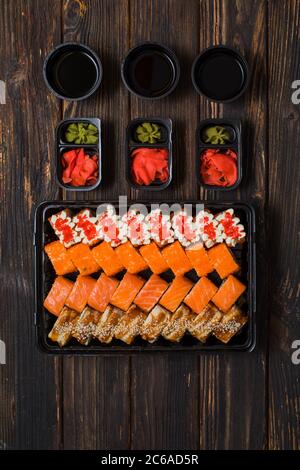Set of Gunkan Maki Sushi with different types of fish salmon, scallop, perch, eel, shrimp and ...