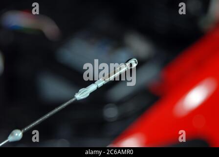 Check the oil level, Top rods to control the engine oil Stock Photo - Alamy
