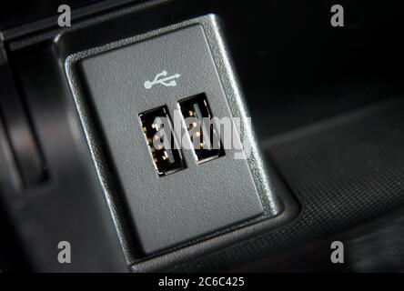 two usb ports on the dashboard of a modern passenger car Stock Photo ...