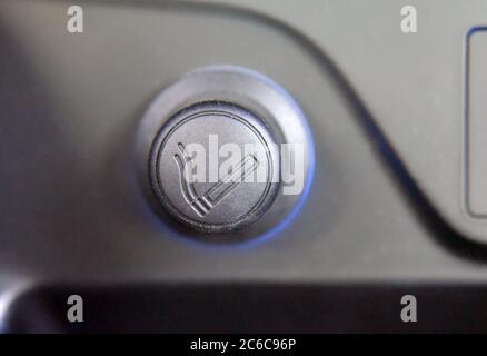 Cigarette lighter on the dashboard of a passenger car Stock Photo - Alamy