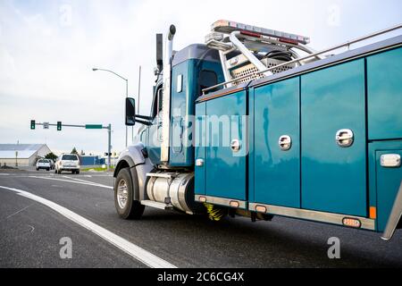 Heavy haulage tow truck towing a National Express coach from Pool ...