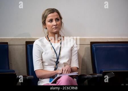 Sarah Matthews, White House deputy press secretary, listens during a ...
