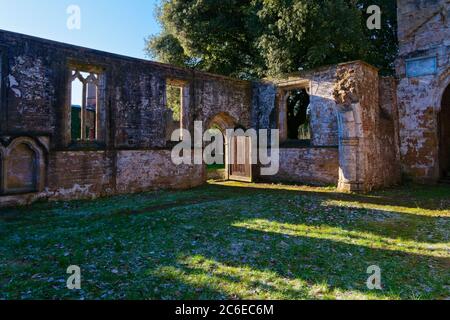 Sunlight streams through the glassless windows of a ruined medieval ...