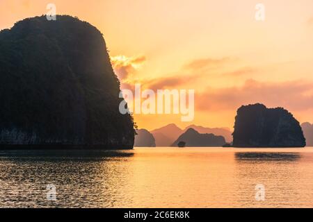 Colorful sunset over Ha Long Bay, Vietnam Stock Photo - Alamy