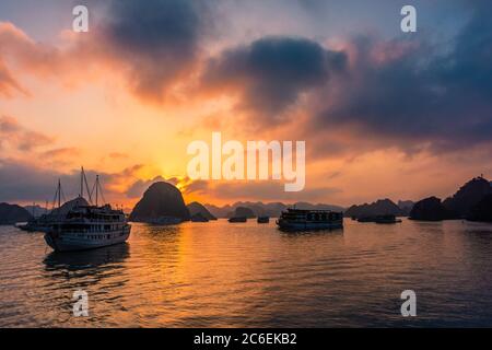 Amazing sunset over Ha Long Bay, Vietnam Stock Photo - Alamy