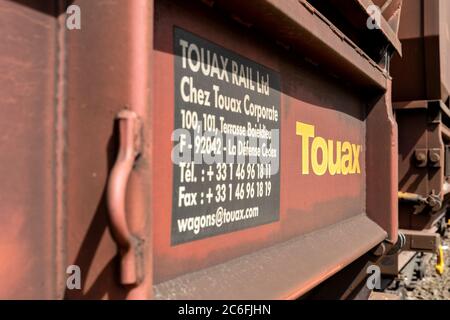 Touax logo at freight railcar. Touax is a French operational leasing ...