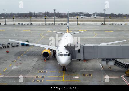 Jetway connected to the airplane for boarding passengers. Boarding ...