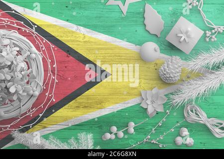 Guyana flag on new year invitation card with red christmas ornaments ...