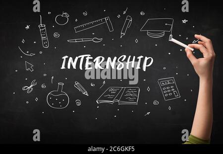 Hand drawing INTERNSHIP inscription with white chalk on blackboard ...