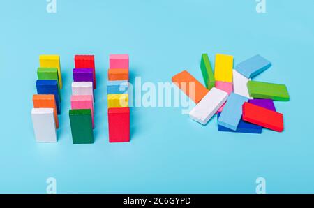 order and chaos. Chaotic unorganized colored dominoes and ordered ...