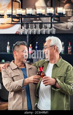 Happy old brothers to drink a toast to celebrate the occasion Stock ...