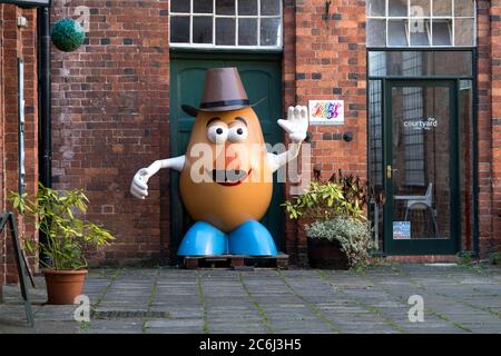 Giant Mr potato head waving Stock Photo - Alamy