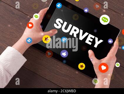 Close-up of a touchscreen with SURVEY inscription, social networking ...