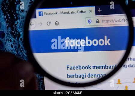 Facebook website page with Facebook logo and magnifying glass showing ...