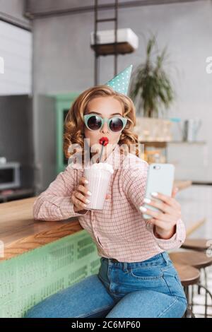 Stylish k-pop girl in sunglasses, asian woman blowing air kiss at ...