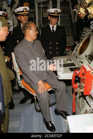 Vice Premier Geng Biao of China is given a tour of the aircraft carrier ...