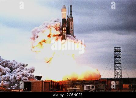Amid clouds of exhaust, a Boeing Delta II expendable launch vehicle ...