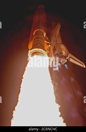 Main engine exhaust, solid rocket booster plume and an expanding ball ...