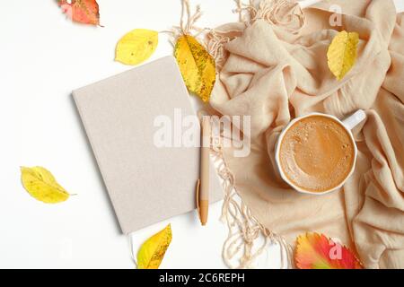 Autumn composition: fallen leaves and notebook mock up on colored ...