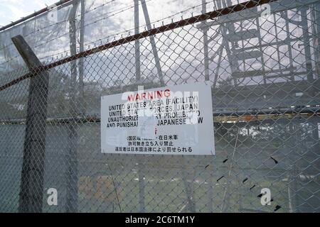 A sign on the fence indicates the territory of the U.S. Marine Corps ...