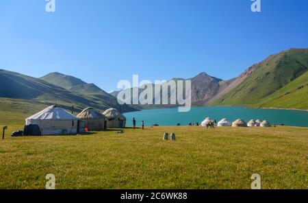 Yurts near a lake at the summer pastures of a nomadic family in ...
