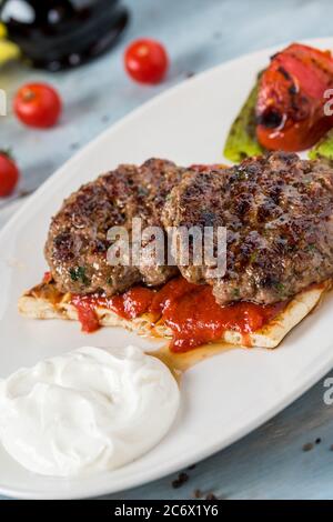 Food with minced lamb. Lamb meatballs and tomato sauce gratin Photo ...